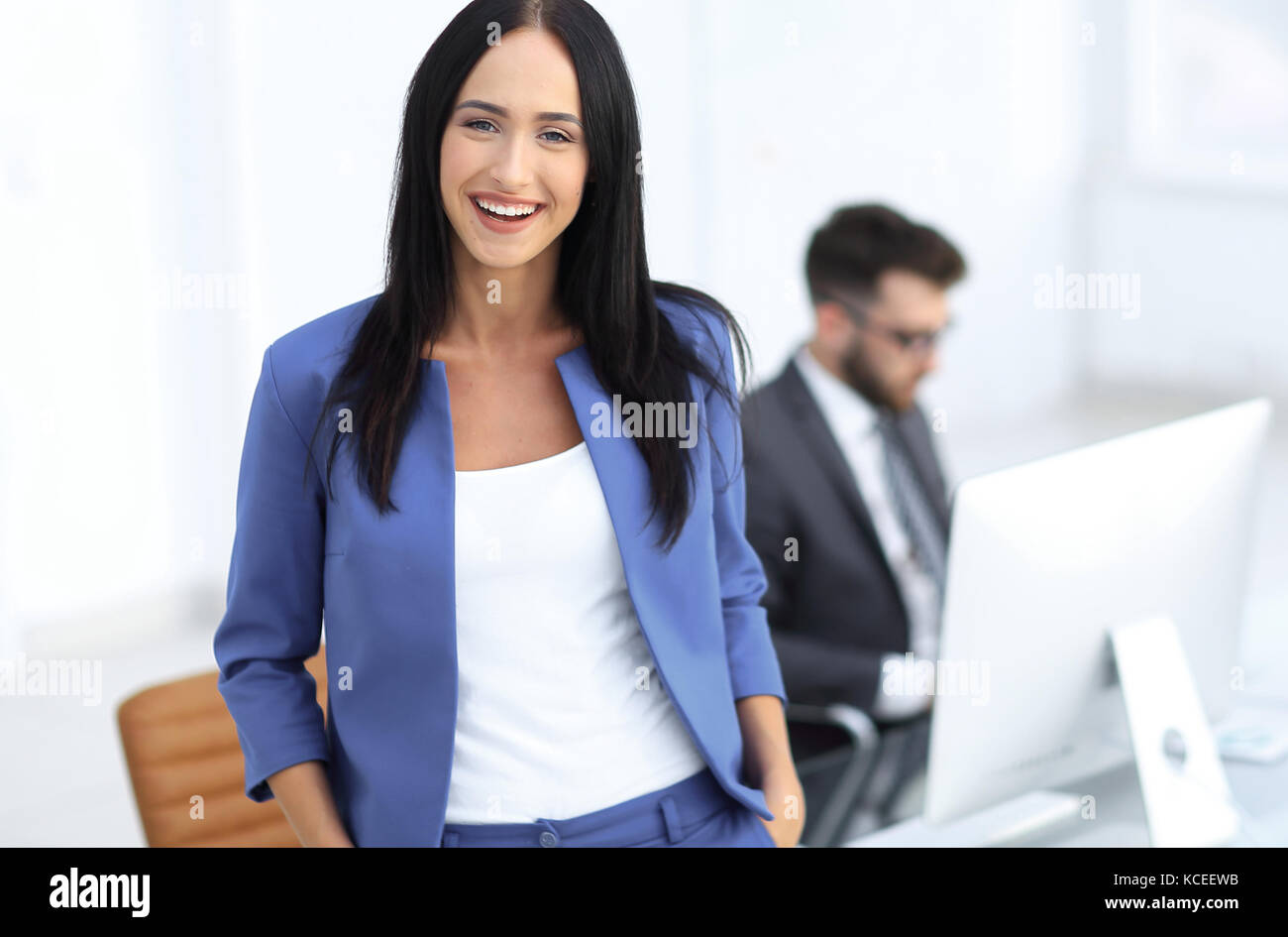 Face of beautiful woman on background of partner in office Stock Photo ...