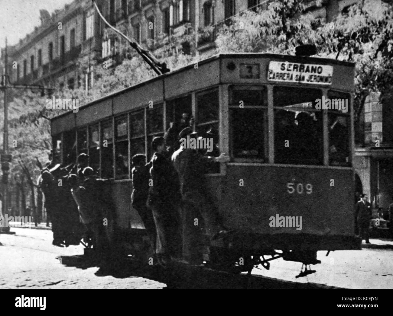 Photograph showing an overcrowded tram during rush hour in Madrid ...