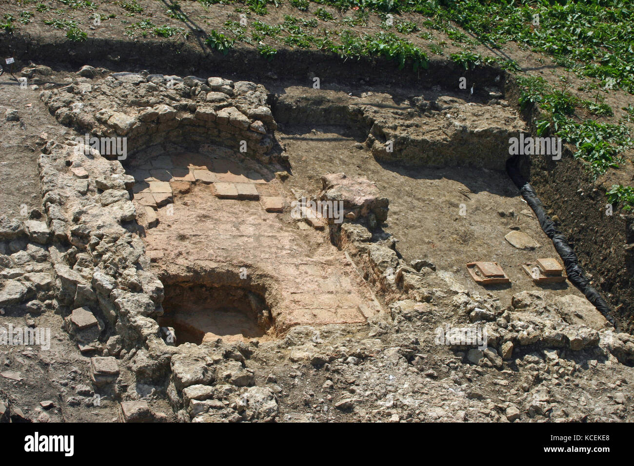 An excavated archaeological dig of a roman villa showing the cold range ...