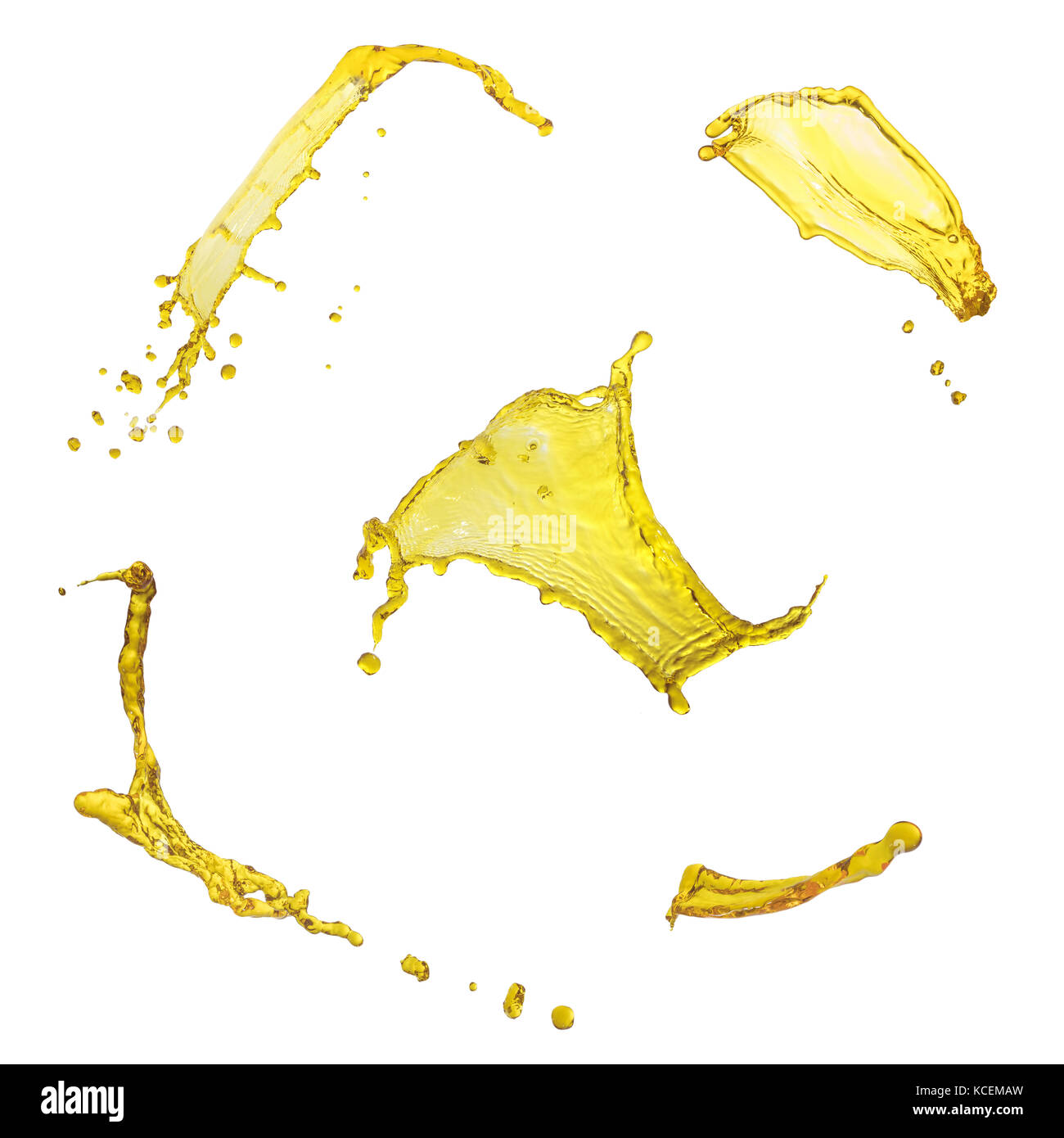 Elegant collection of flying oil liquid splashes yellow color over ...