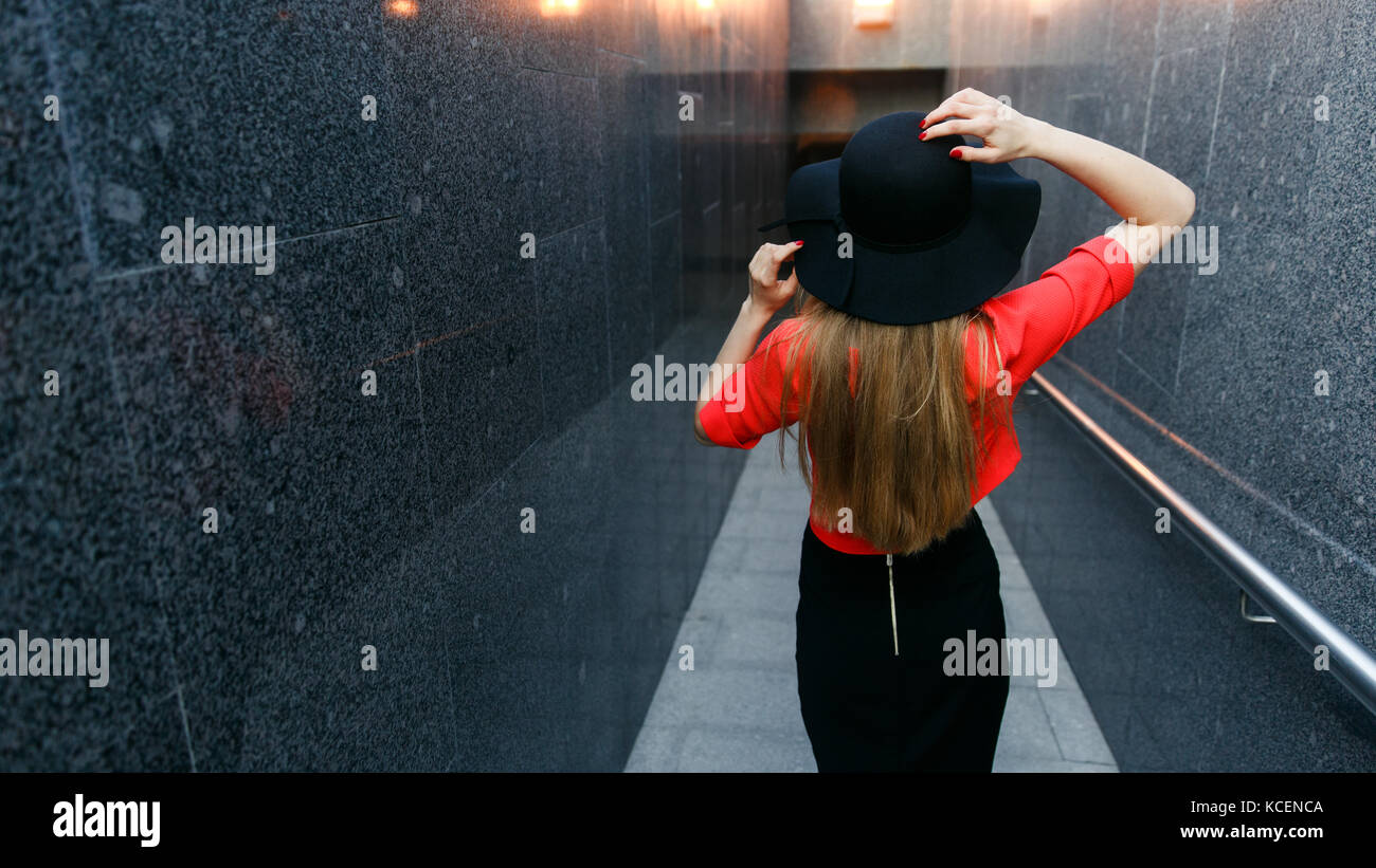 Photo from back of girl in black hat Stock Photo - Alamy