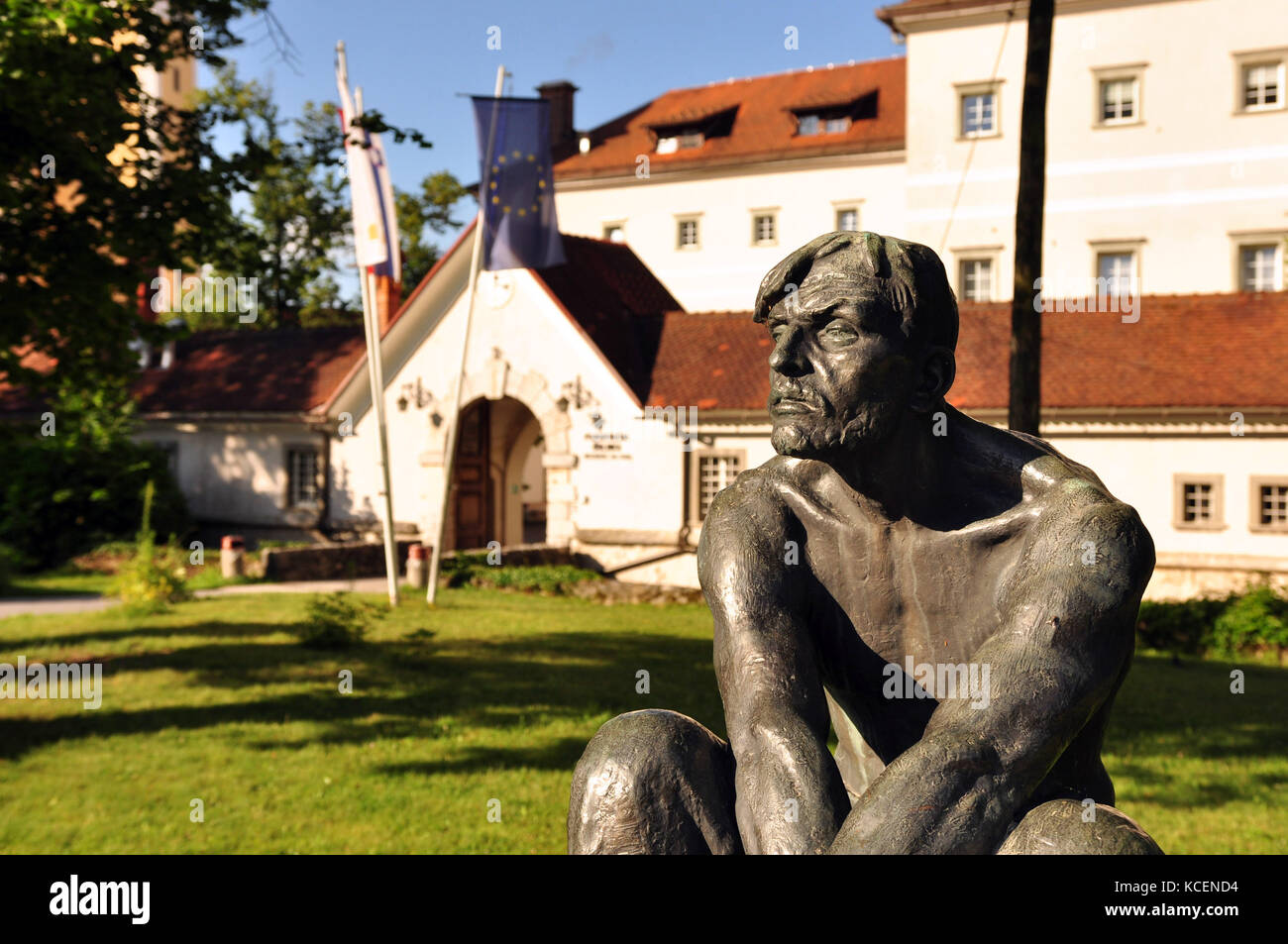 Statue of a man in front of a hospital Stock Photo - Alamy