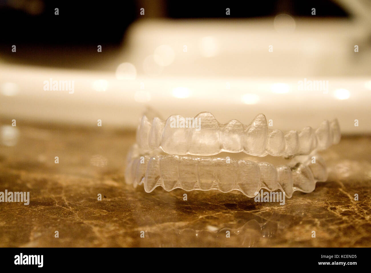 Invisible orthodontics for aligning teeth Stock Photo - Alamy