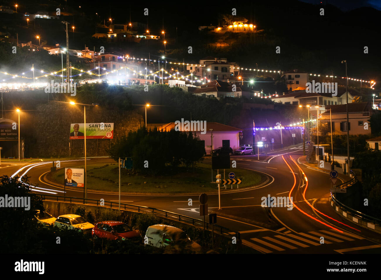 Light trails on roundabout at night Stock Photo - Alamy