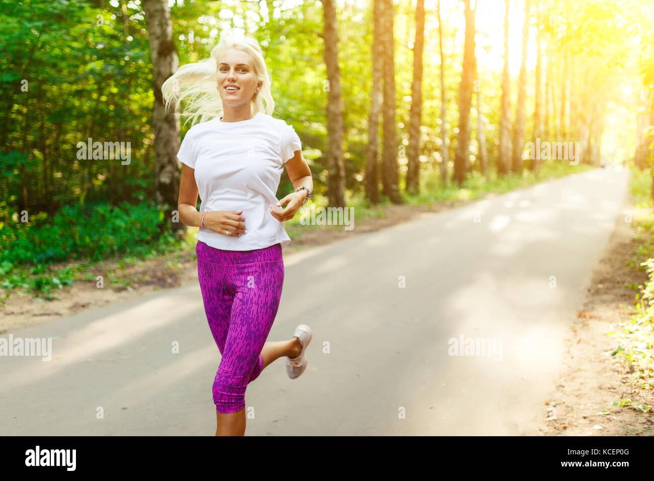 Image of sports girl running on road Stock Photo - Alamy