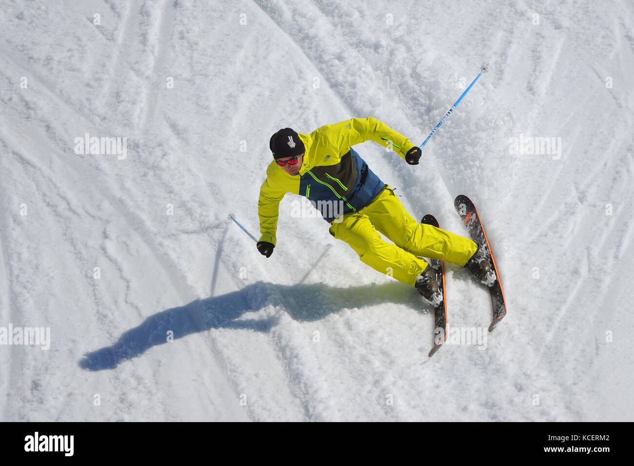 A skier carves a turn photographed from above Stock Photo - Alamy
