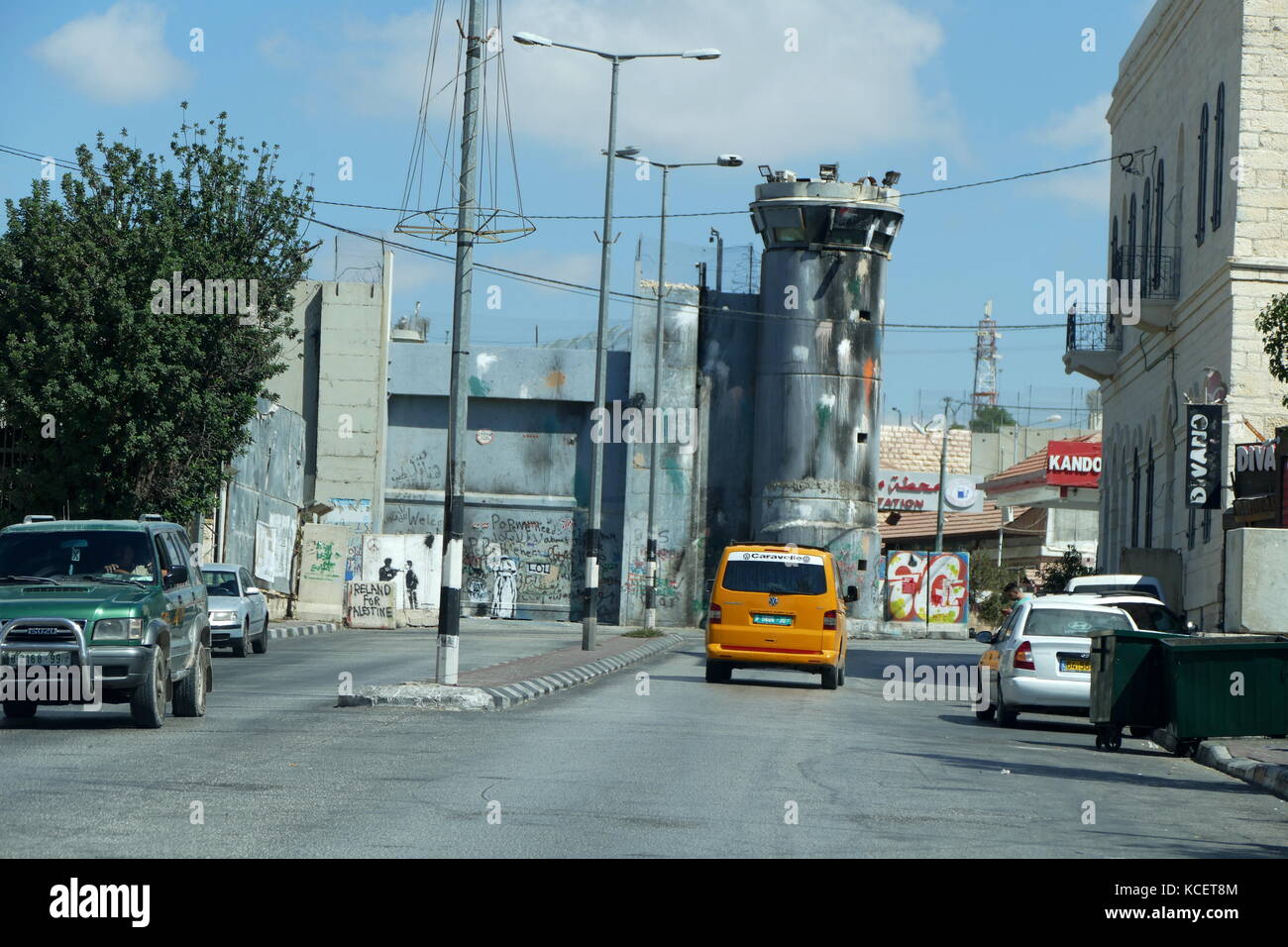Guard tower at the entrance to a walled refugee camp in the Palestinian ...