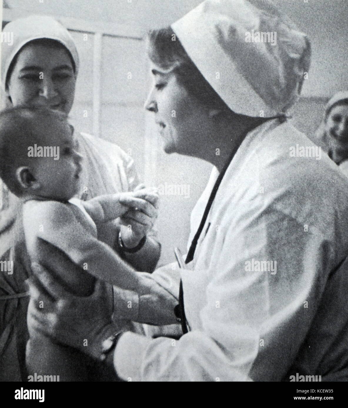Soviet Russian paediatrician and nurse examine a baby at a hospital ...