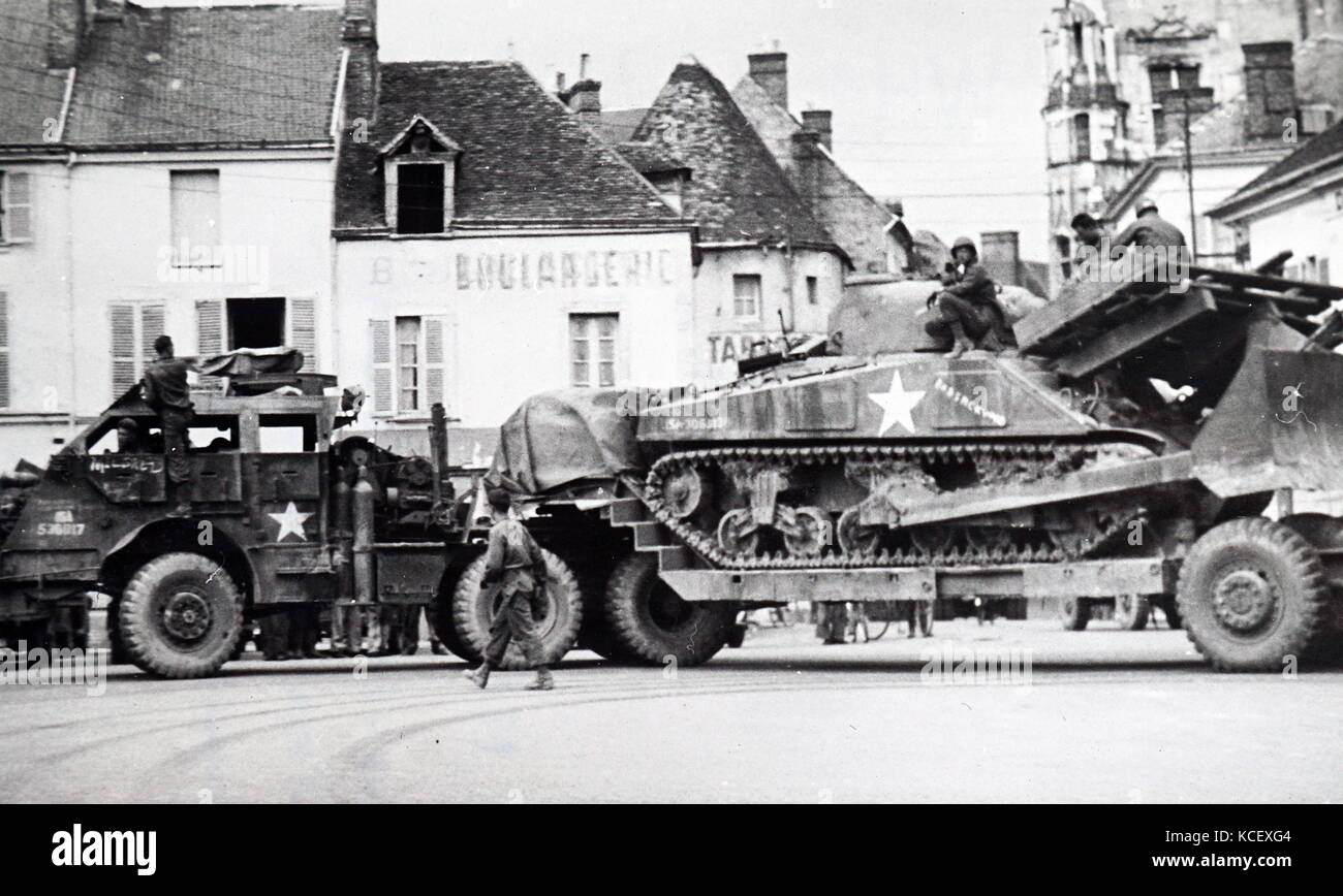Photograph of American forces enter a town in Northern France, during ...