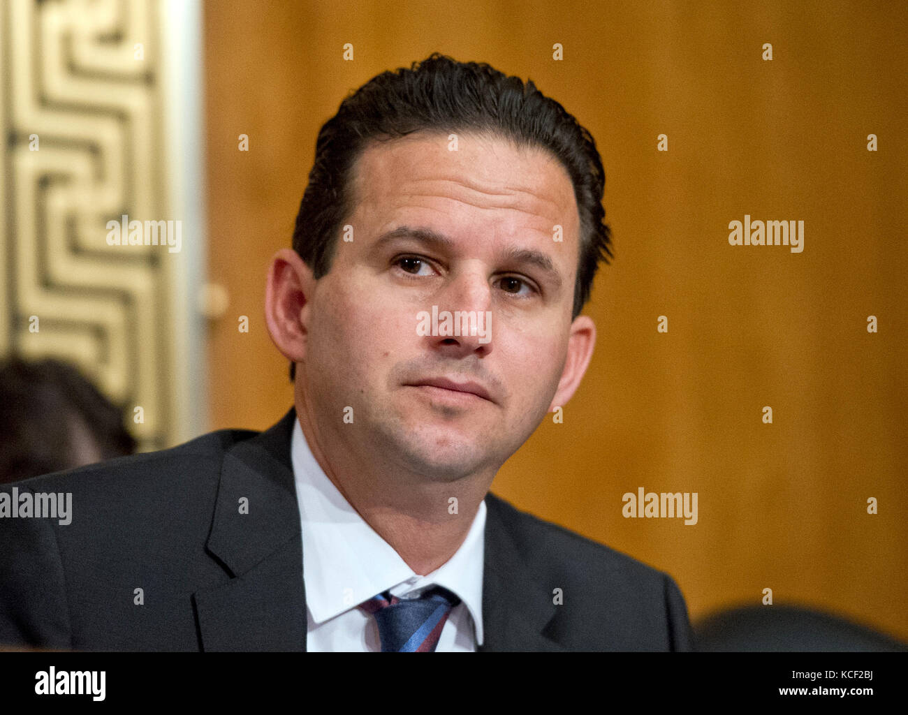 United States Senator Brian Schatz (Democrat of Hawaii) listens as ...