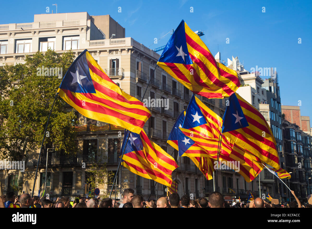 Barcelona, Spain - October 3, 2017. Demonstrators bearing catalan flags ...