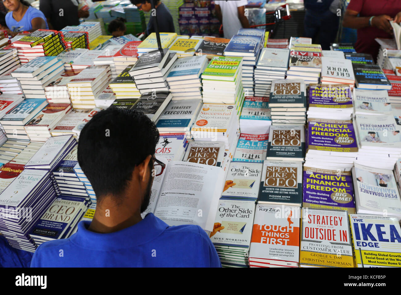 A man read a book during the, Biggest book sale in Colombo. Sir Lanka ...