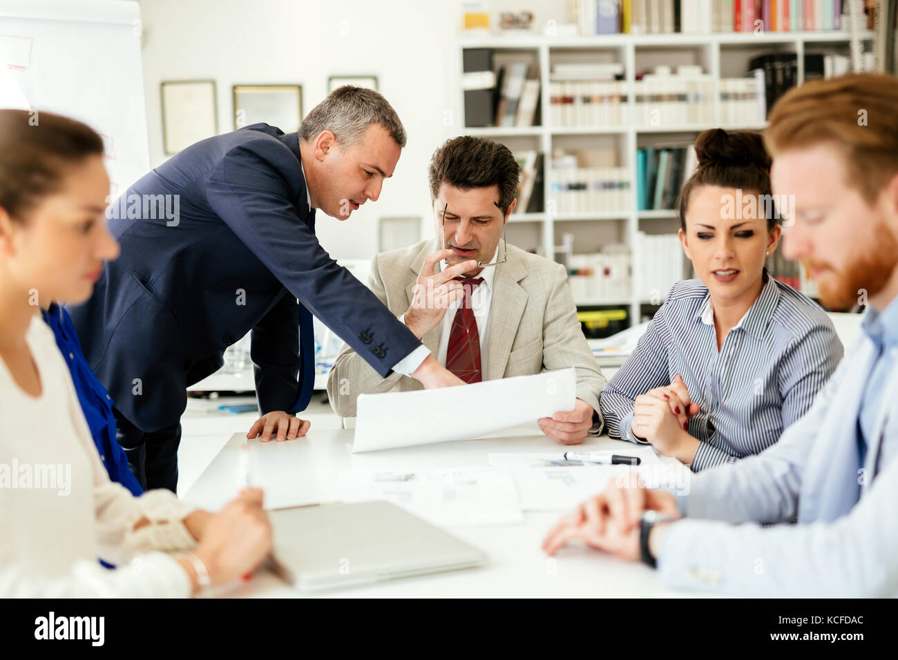 Business people having a board meeting Stock Photo - Alamy