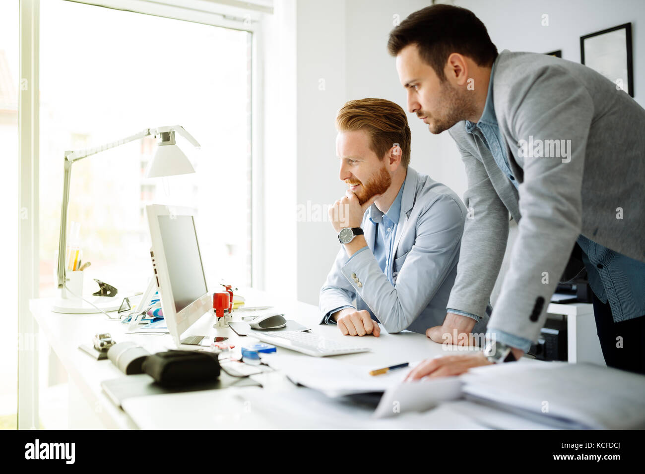 Coworkers working together table hi-res stock photography and images ...