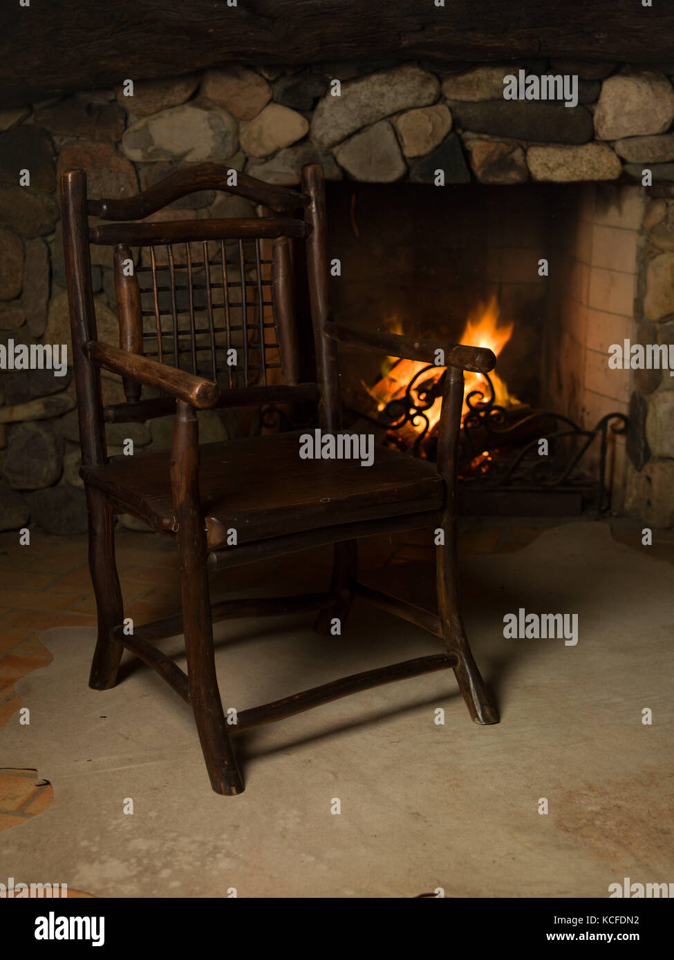 Fireplace home with chair Stock Photo - Alamy