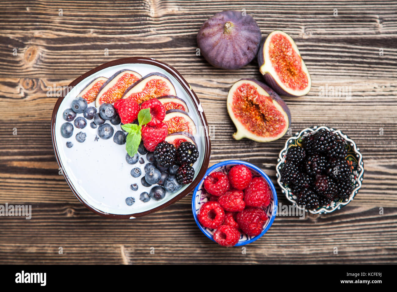 Delicious yoghurt bowl with berries and figs Stock Photo - Alamy