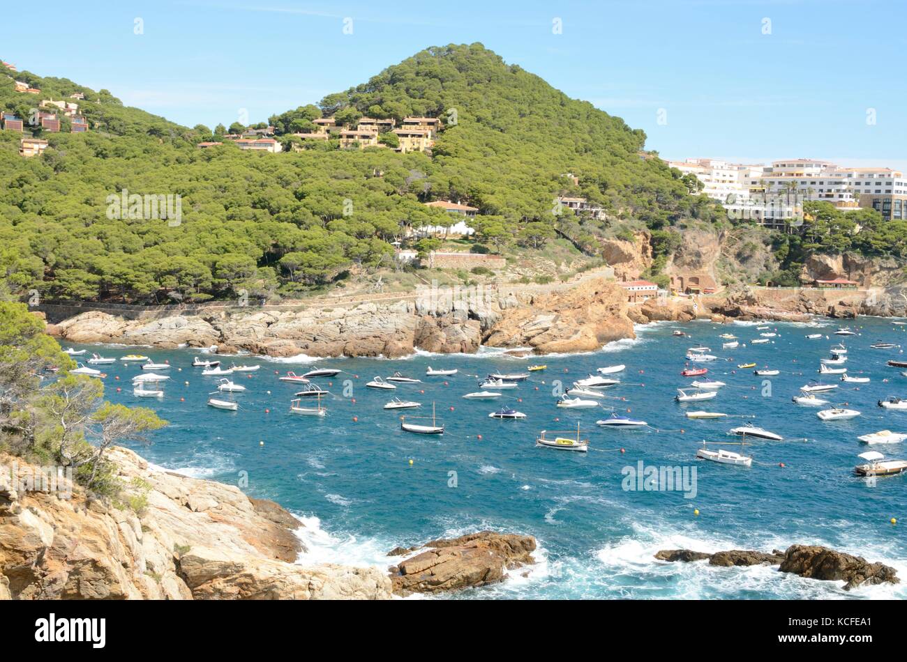 Picturesque view of small cove with ships at the sea in Sa Riera, Begur ...