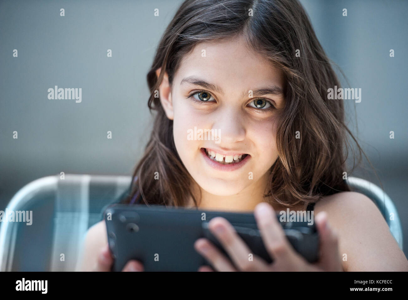 Child; girl; cell phone; smile Stock Photo - Alamy