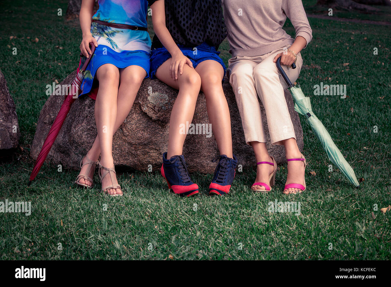 Legs; Women, sitting; stone Stock Photo - Alamy