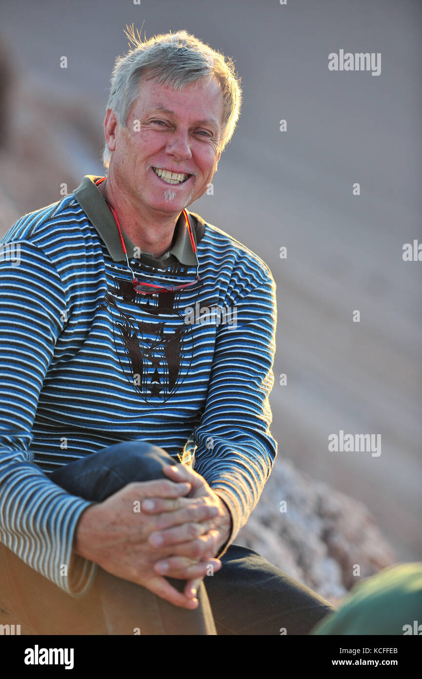 Person, man, sitting, smiling Stock Photo - Alamy