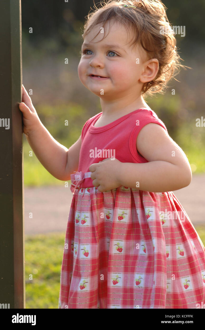 Baby, girl; 1 year, isolated, green background Stock Photo - Alamy