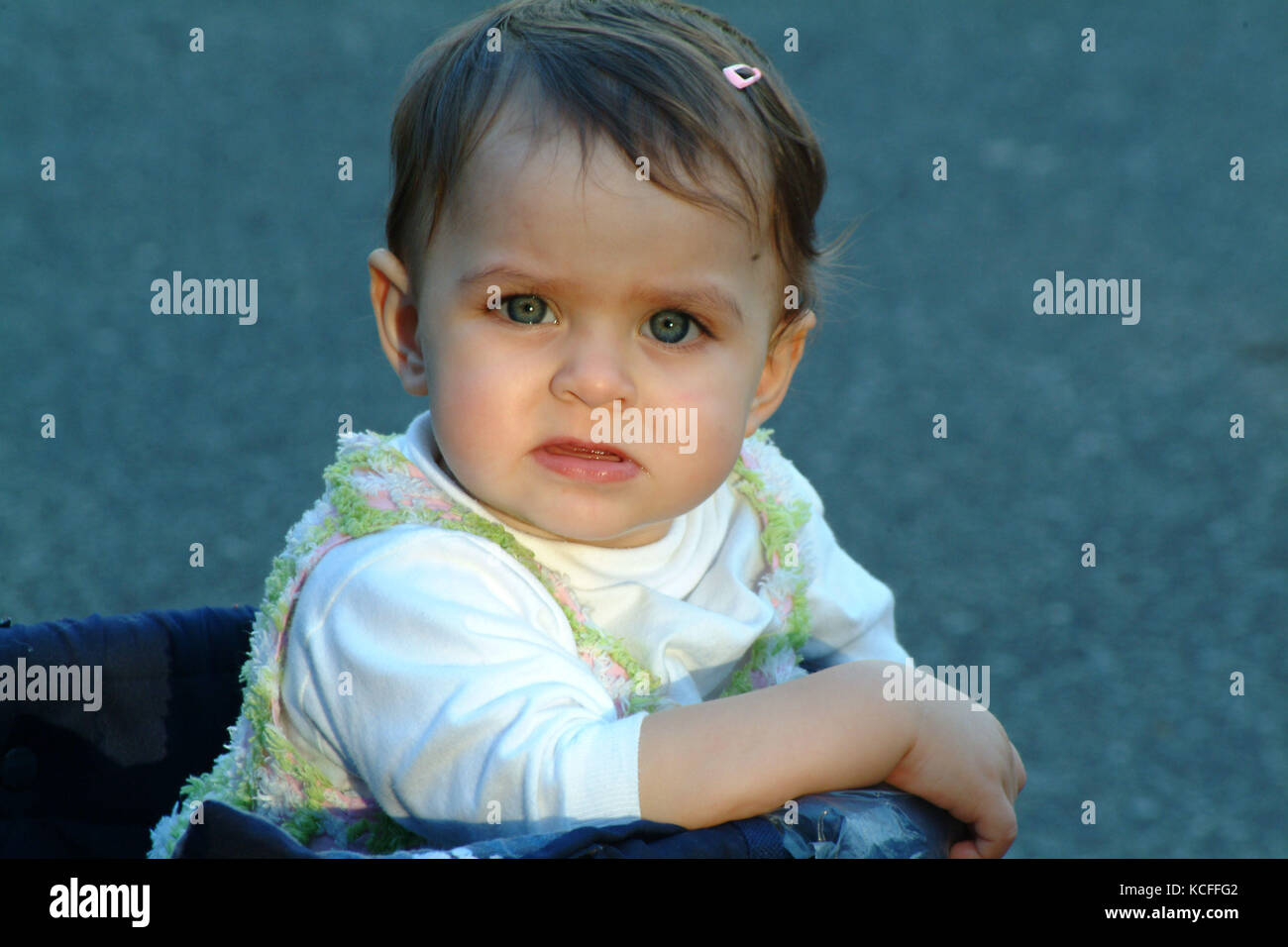 Baby, girl; 9 months, isolated, blue background Stock Photo - Alamy