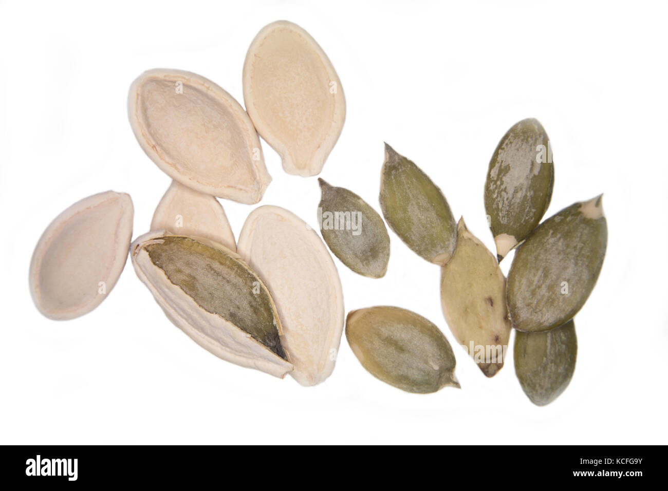 Pumpkin seeds whole and peeled on a white background Stock Photo - Alamy