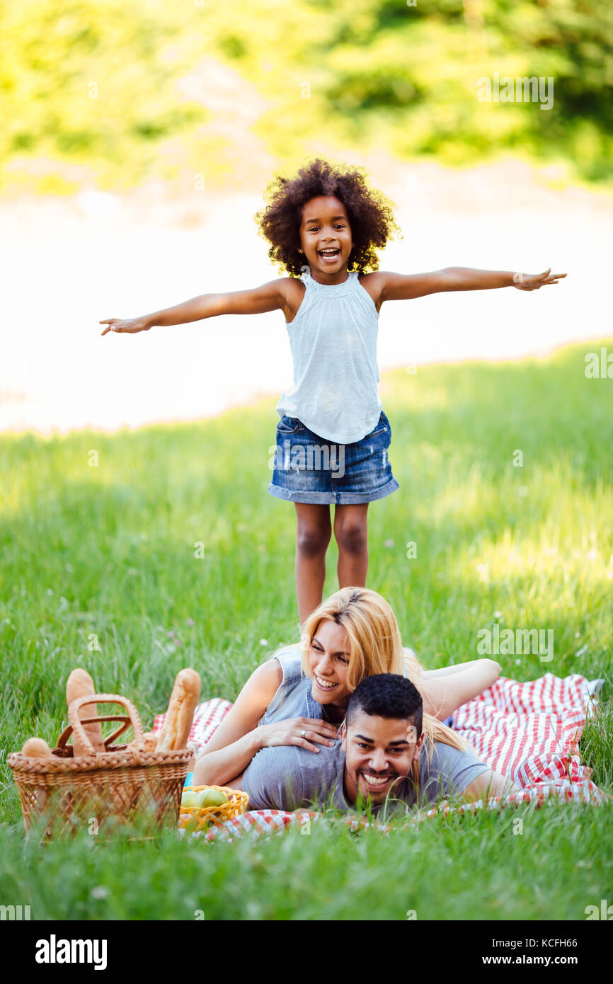 Happy family having fun time on picnic Stock Photo - Alamy
