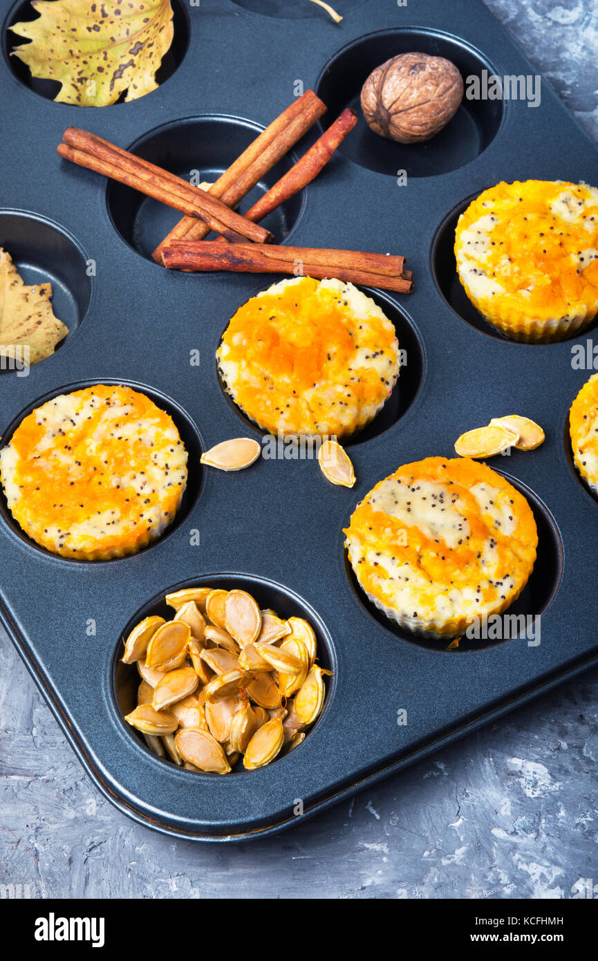 Appetizing autumn muffin with pumpkin in baking dish Stock Photo - Alamy