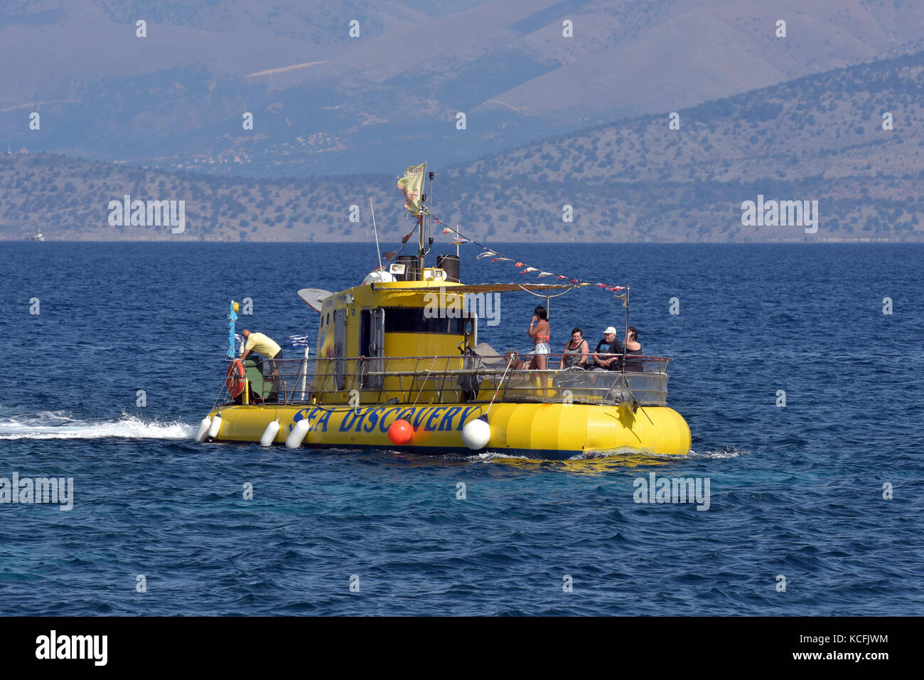 A yellow submarine glass bottomed boat in the greek town of kassiopi on ...