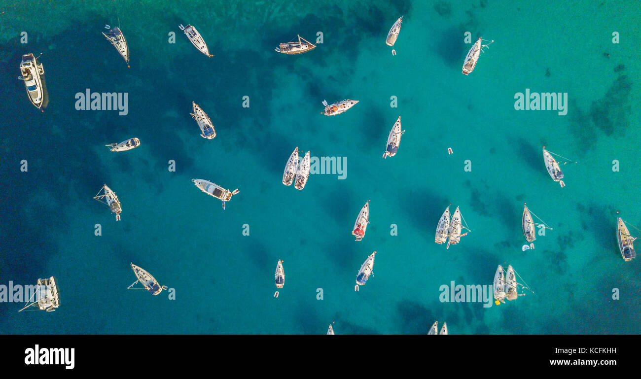 Aerial view of group of sailing boats anchoring on buoys. Bird eye view ...