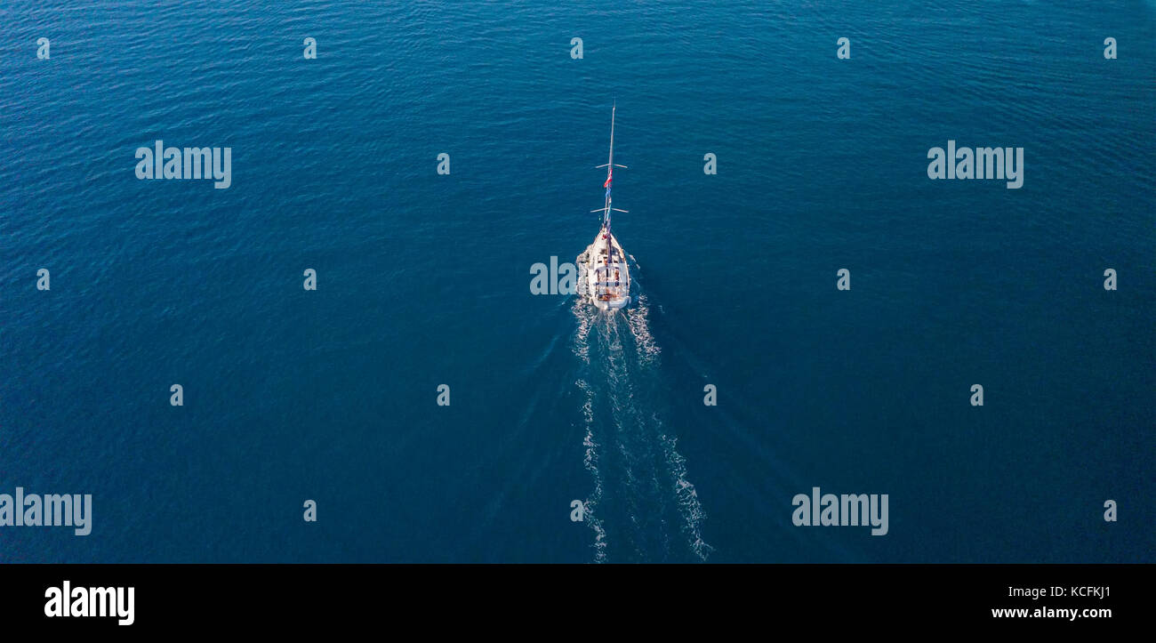 Aerial view of sailing boat on open sea. Bird eye view, water sport and ...