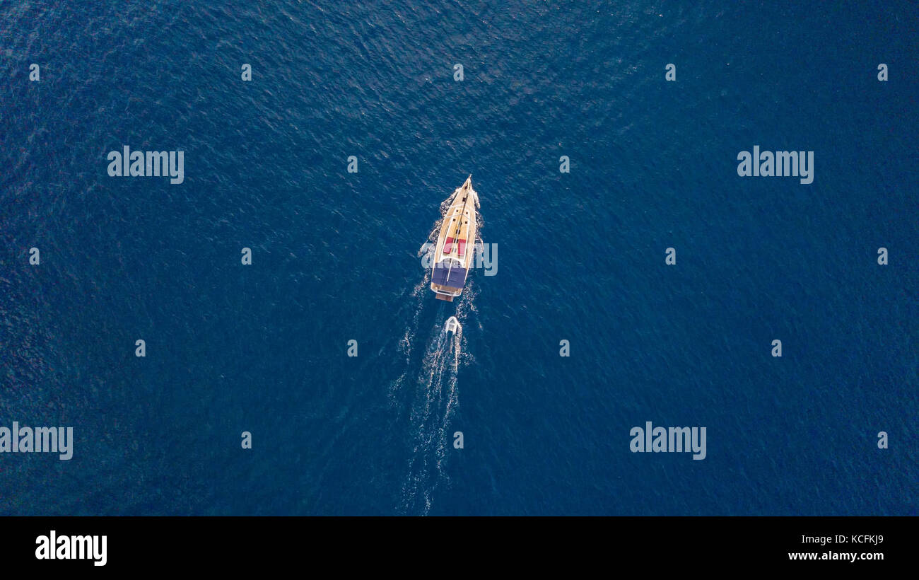 Aerial view of sailing boat on open sea. Bird eye view, water sport and ...