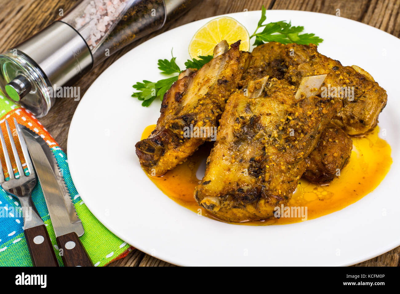 Spicy meat ribs in mustard sauce on wooden table Stock Photo - Alamy