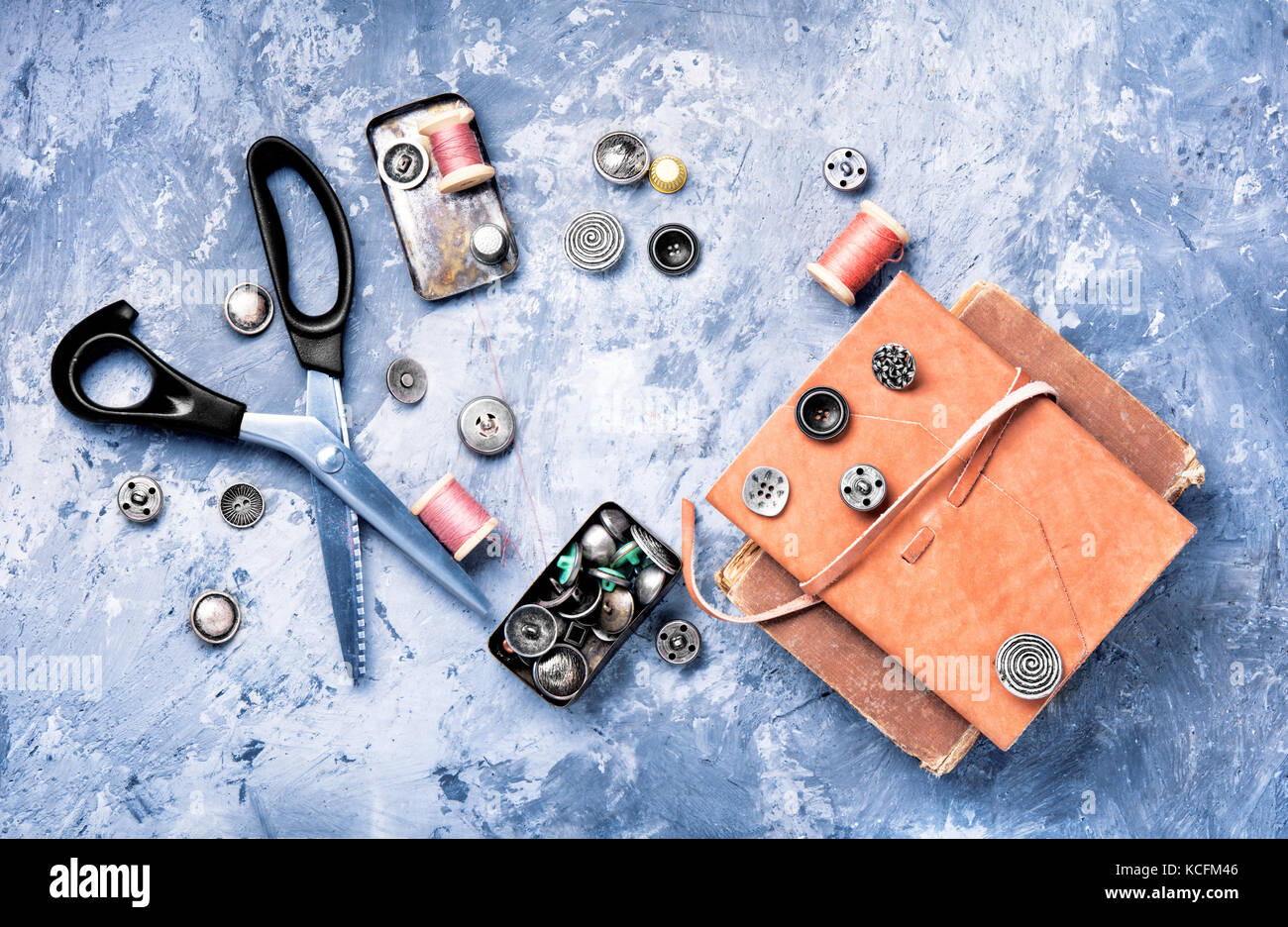 Fashionable buttons for clothes, scissors and sewing threads.Copy space ...