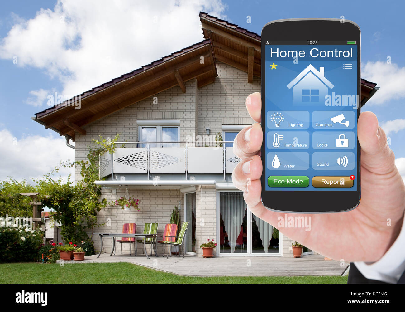 Close-up Of A Hand Holding Mobile Phone With Home Control System In ...
