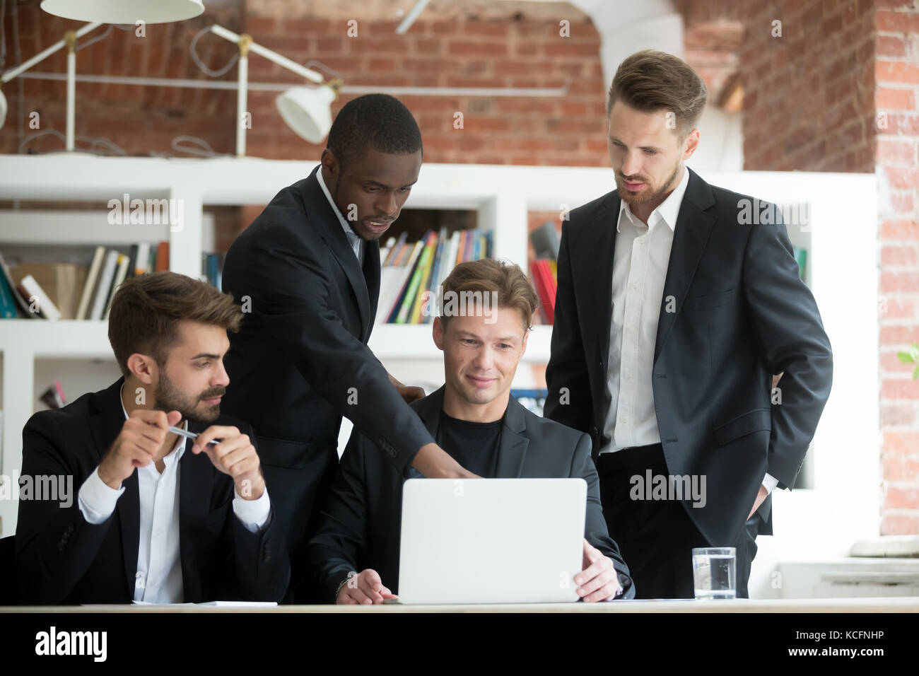 Coworkers looking pc screen hi-res stock photography and images - Alamy