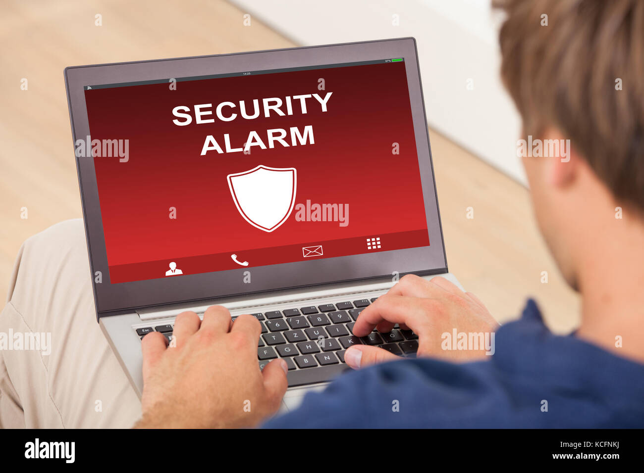 Close-up Of A Man Using Laptop Showing Security Alarm On Screen Stock ...