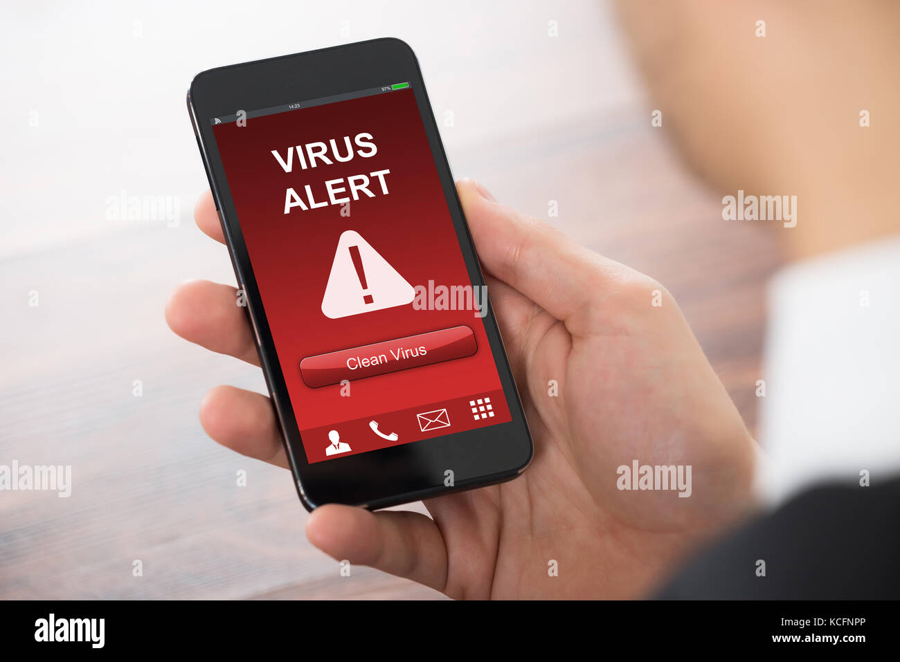 Close-up Of A Businessman Holding Mobile Phone With Virus Alert On ...