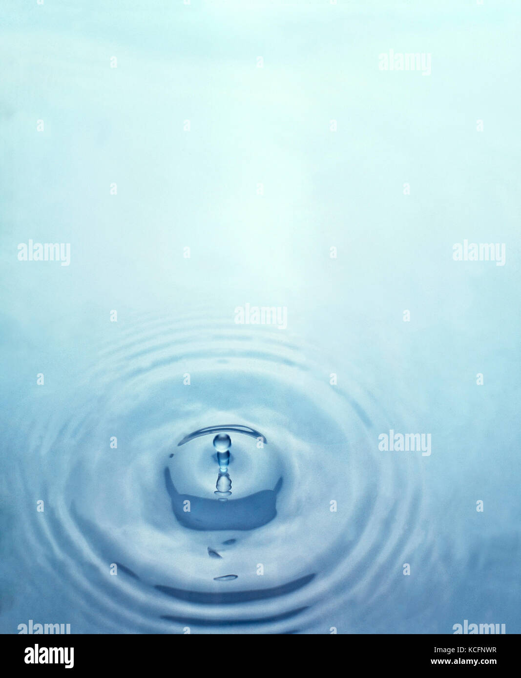 ripples and splash from water drop Stock Photo - Alamy