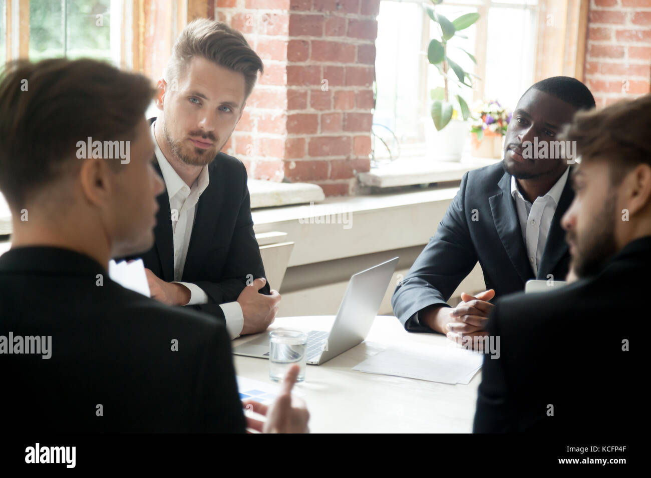 CEO discussing corporate matters with group of employees. Boss ...