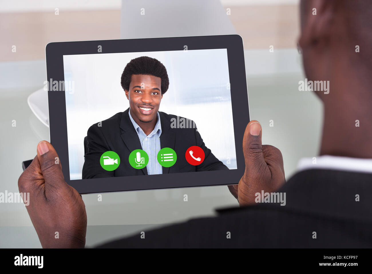 Close-up Of A Businessperson Video Chatting With Colleague Stock Photo ...
