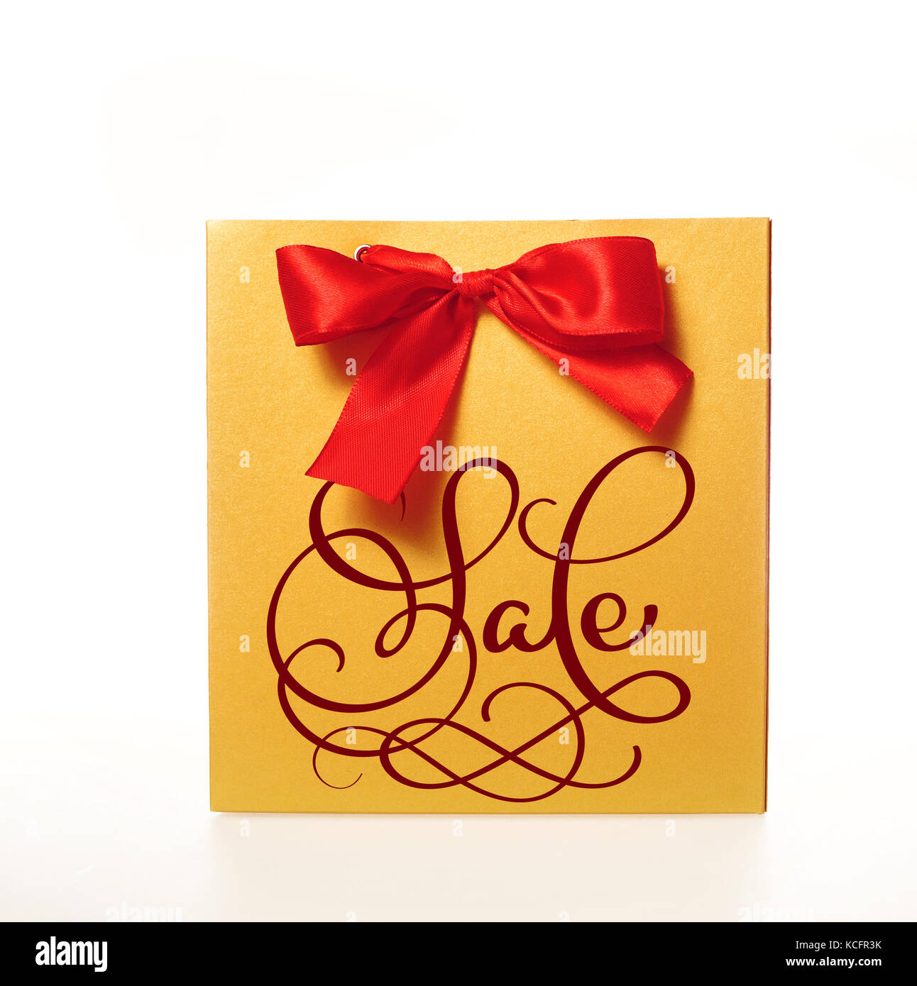 Sale calligraphy word on package with red bow isolated on white ...