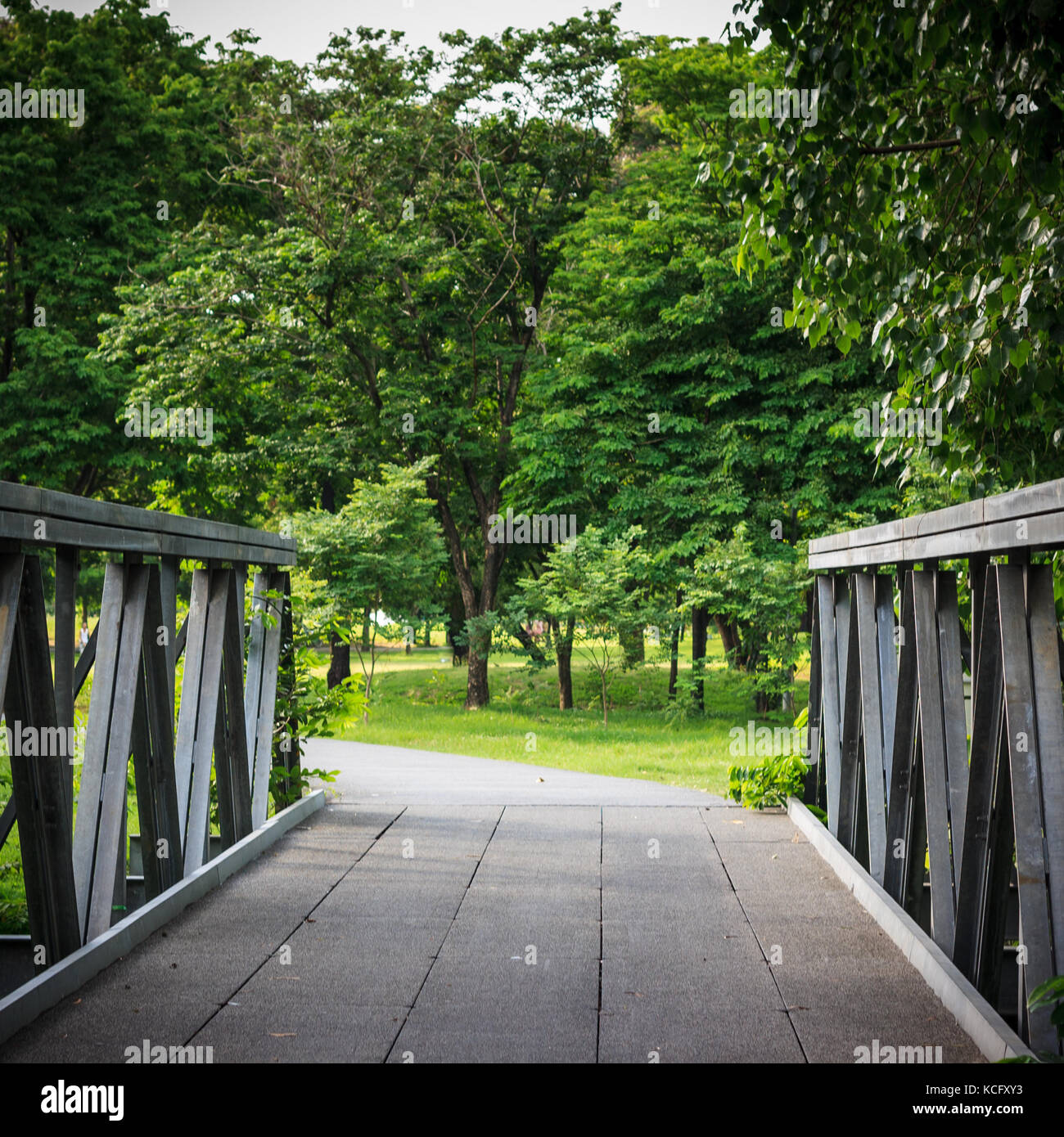 Metal bridge entrance to public park Stock Photo - Alamy