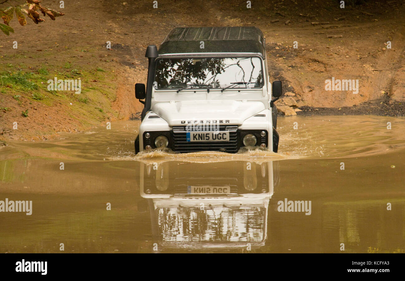 Off road 4x4 through the river in a Land Rover Defender Stock Photo - Alamy