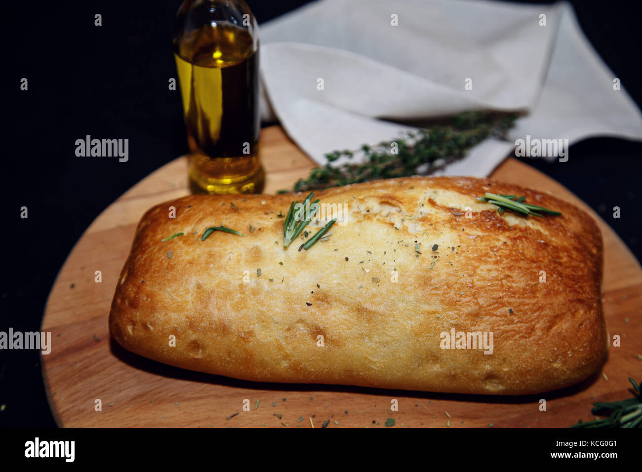 Traditional Italian ciabatta bread with herbs. Black background Stock ...