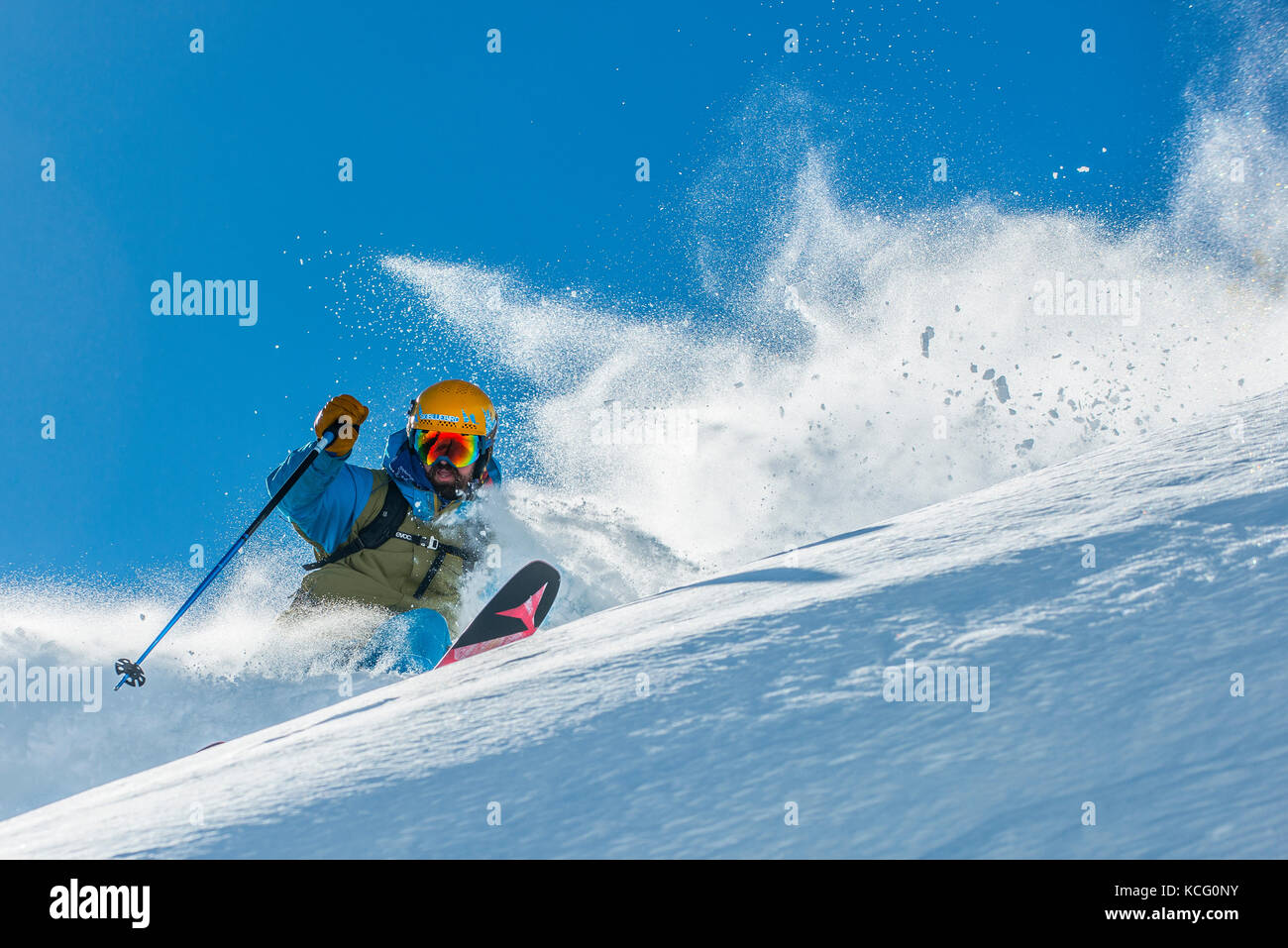 A skier turns off piste in powder in the French ski resort of ...