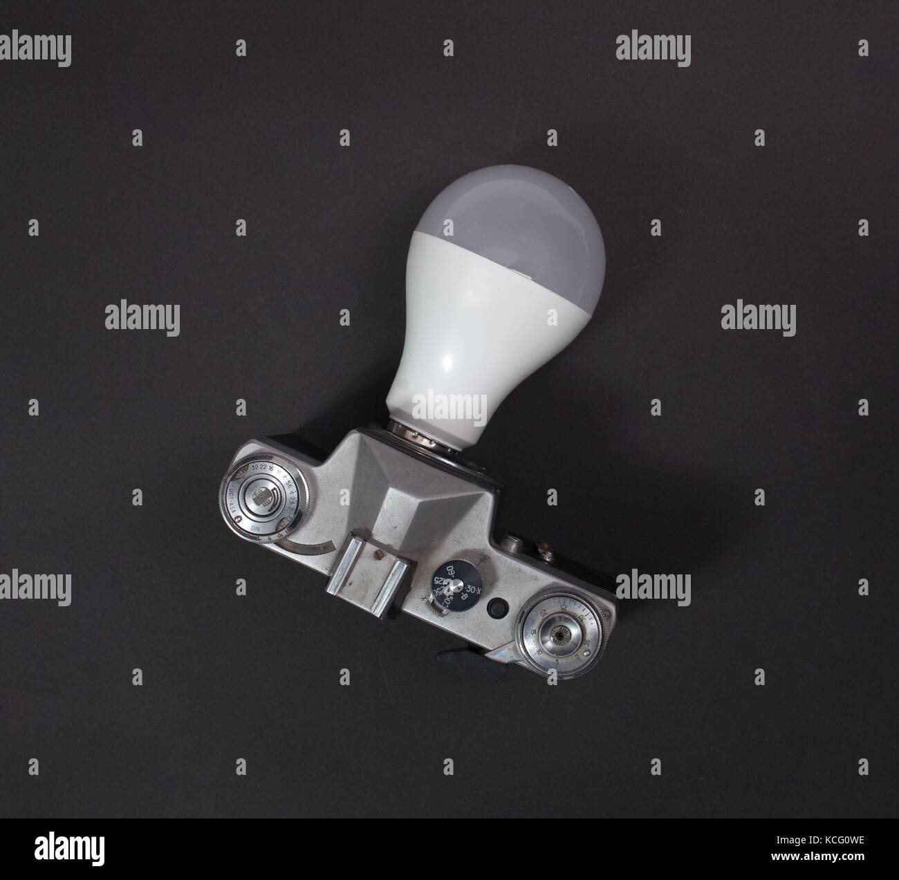 Vintage camera with a led bulb instead of a lens. Concept photo. Top ...