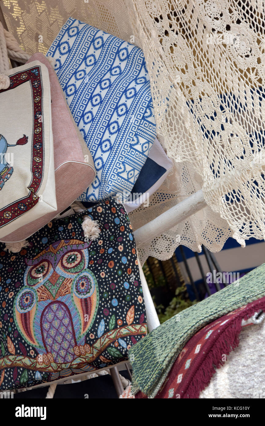 Lace and woven fabrics and materials for sale at a Greek souvenir or ...