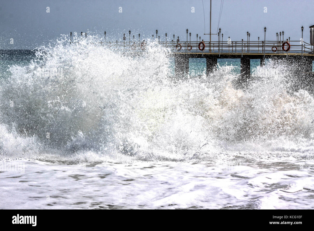 Big stormy sea wave splash against pier Stock Photo - Alamy